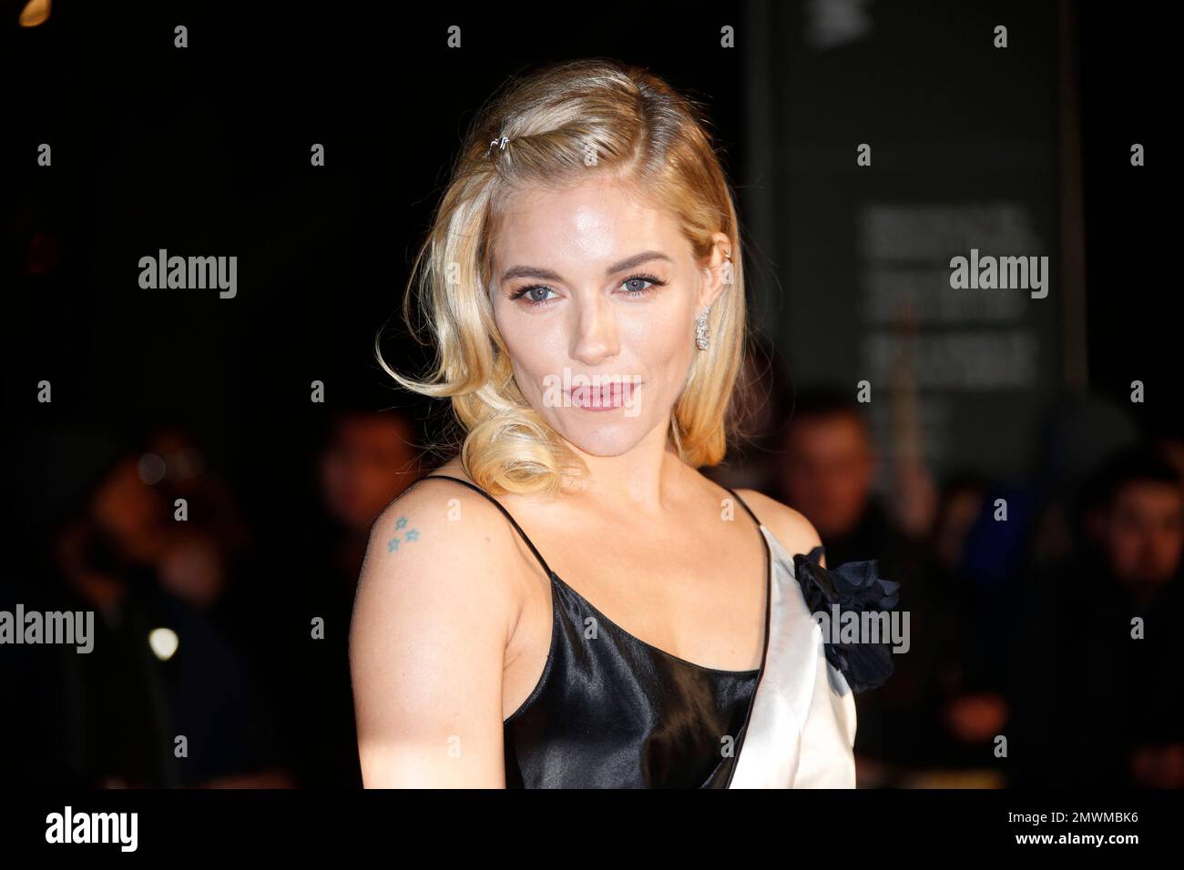Actress Sienna Miller poses for photographers upon arrival at the ...