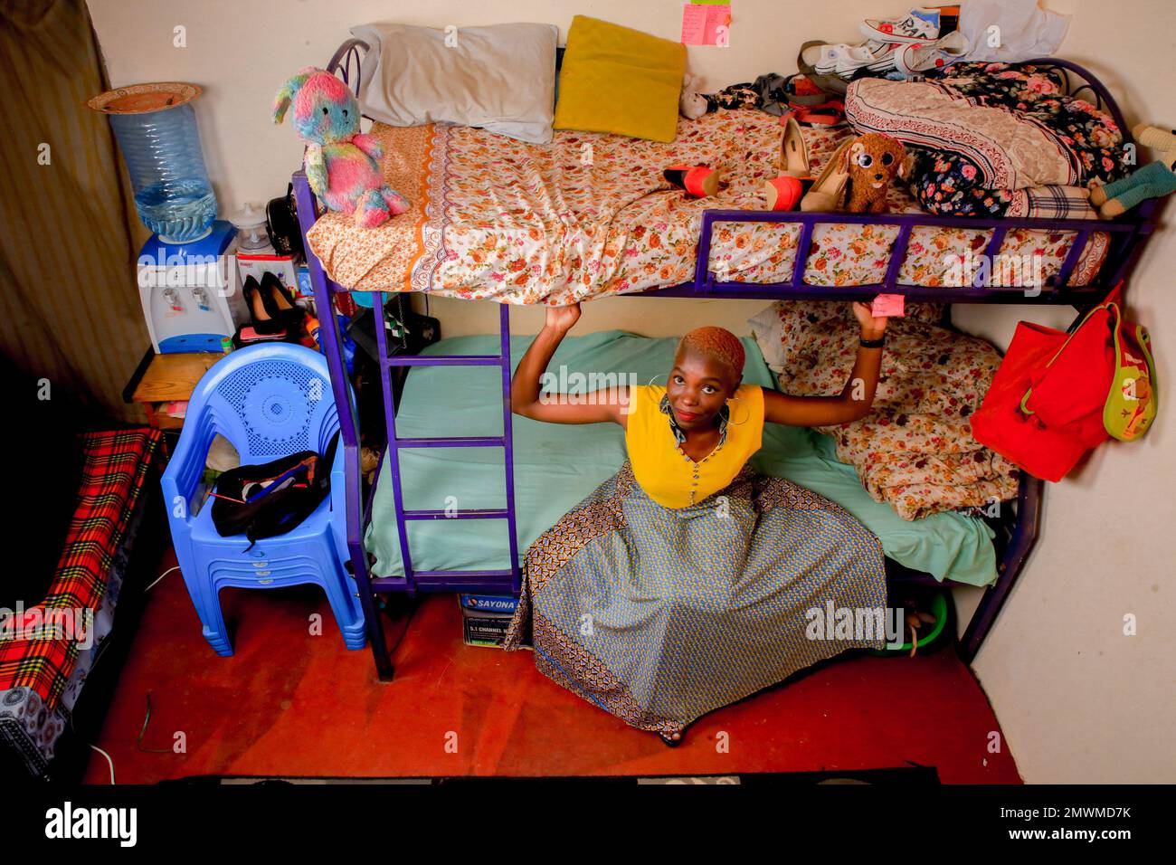 23-Year-Old model Risper Atieno poses on her bed during a photo project ...