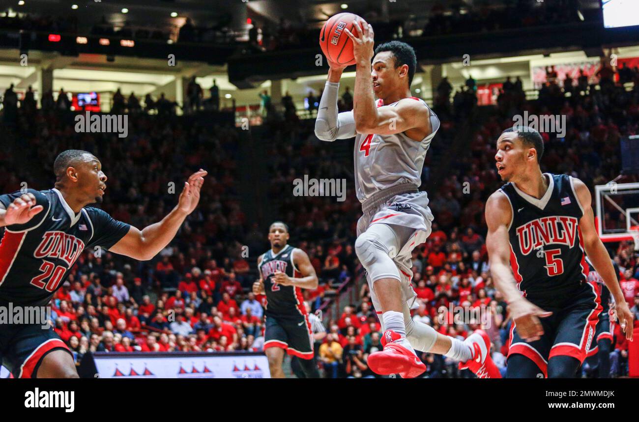 New Mexico's Elijah Brown (4) looks to pass as UNLV's Christian Jones ...