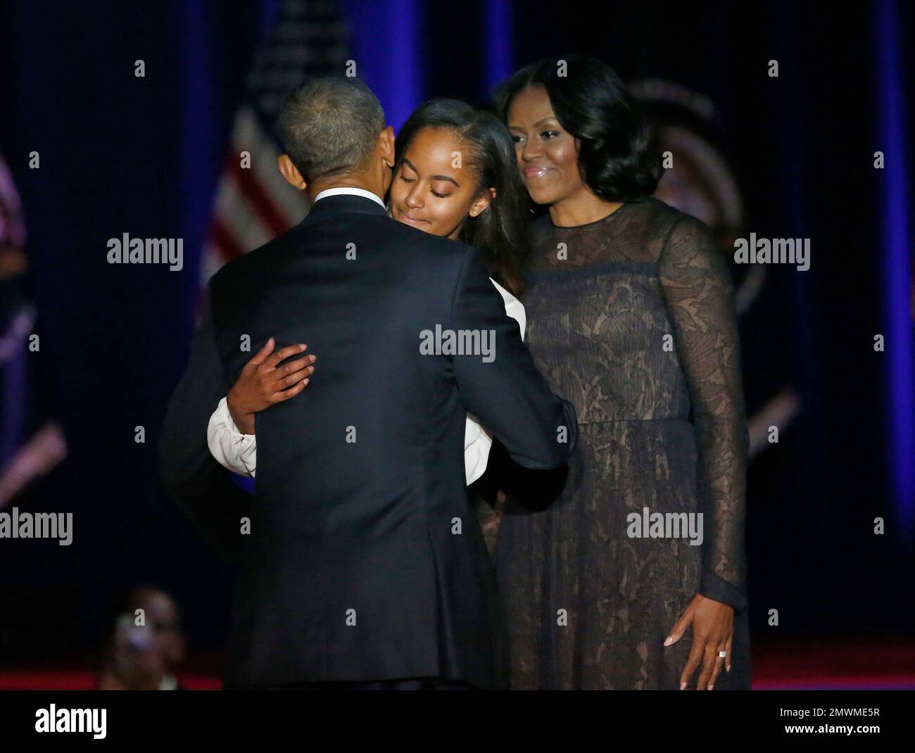President Barack Obama is joined by his daughter Malia and First Lady ...