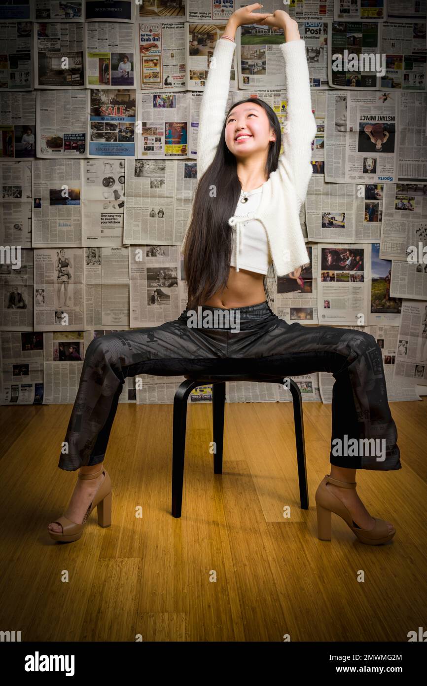 Full Body Tall Teenage Asian Girl Seated in Front of Backdrop of ...
