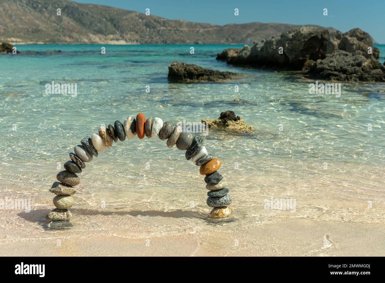 An arch made of small stones(Rock stacking) at the famous Balos beach ...