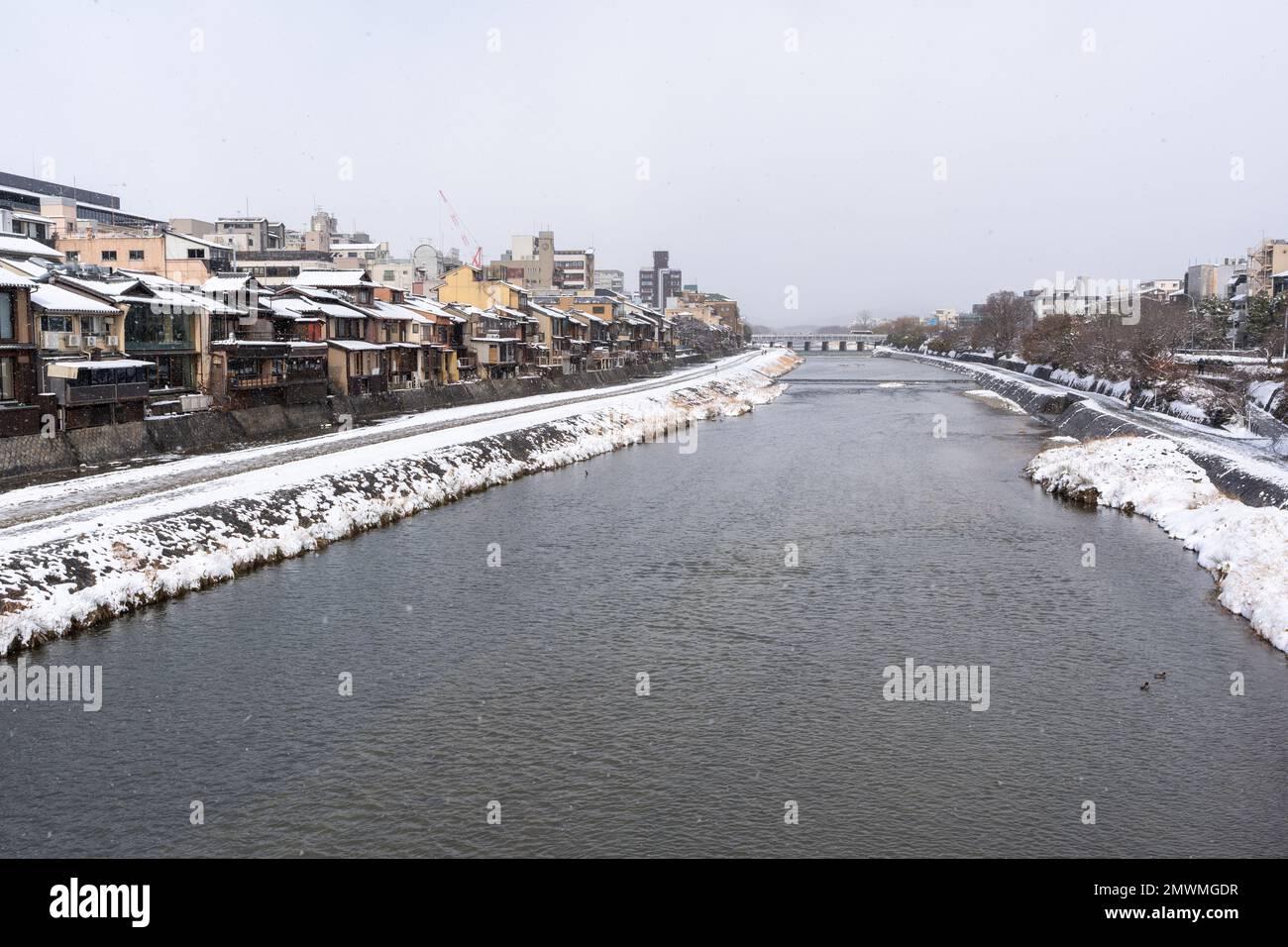 Snowy Kamo River ( Kamogawa ) in winter, Gion District, Kyoto, Japan ...