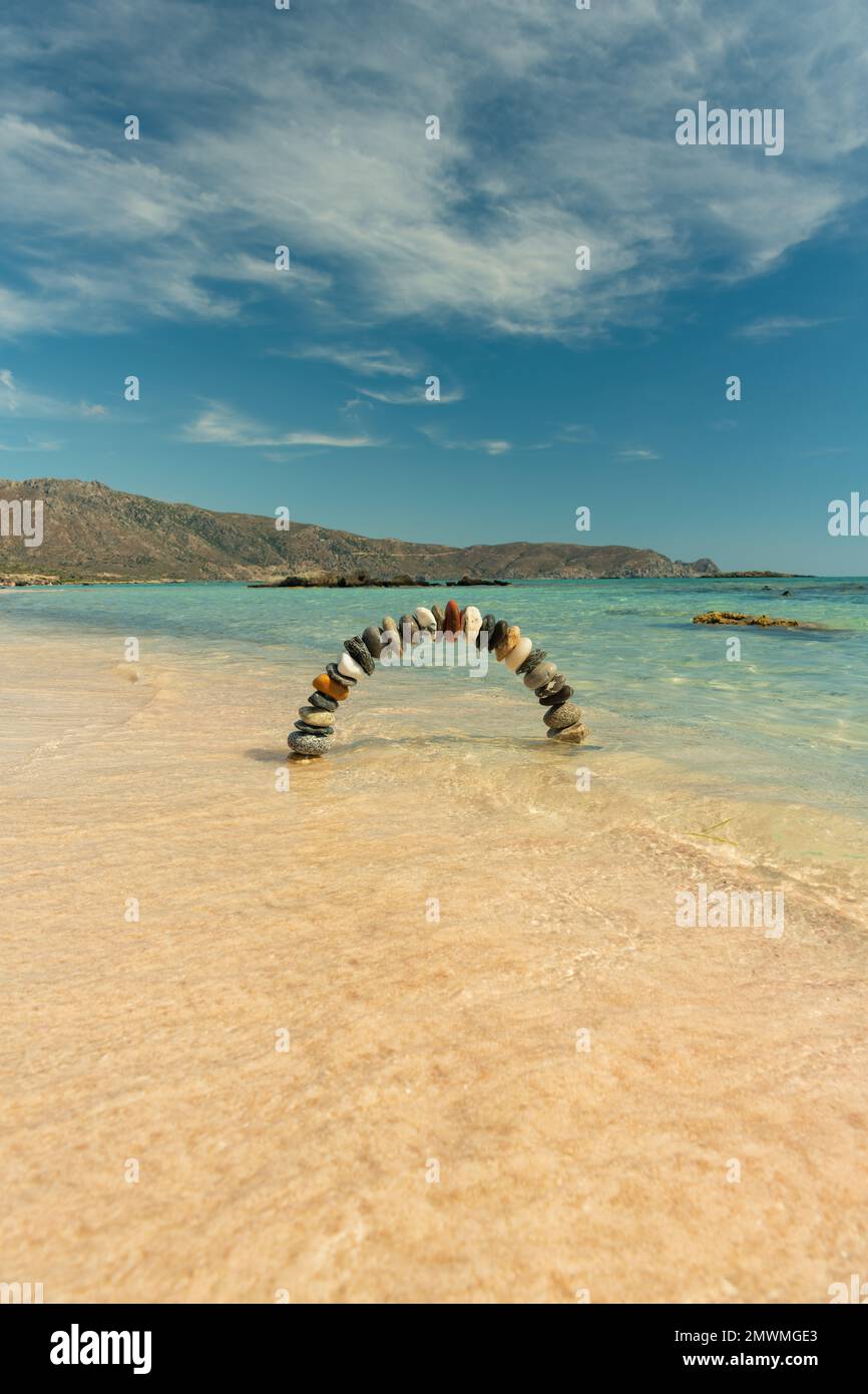 An arch made of small stones(Rock stacking) at the famous Balos beach ...