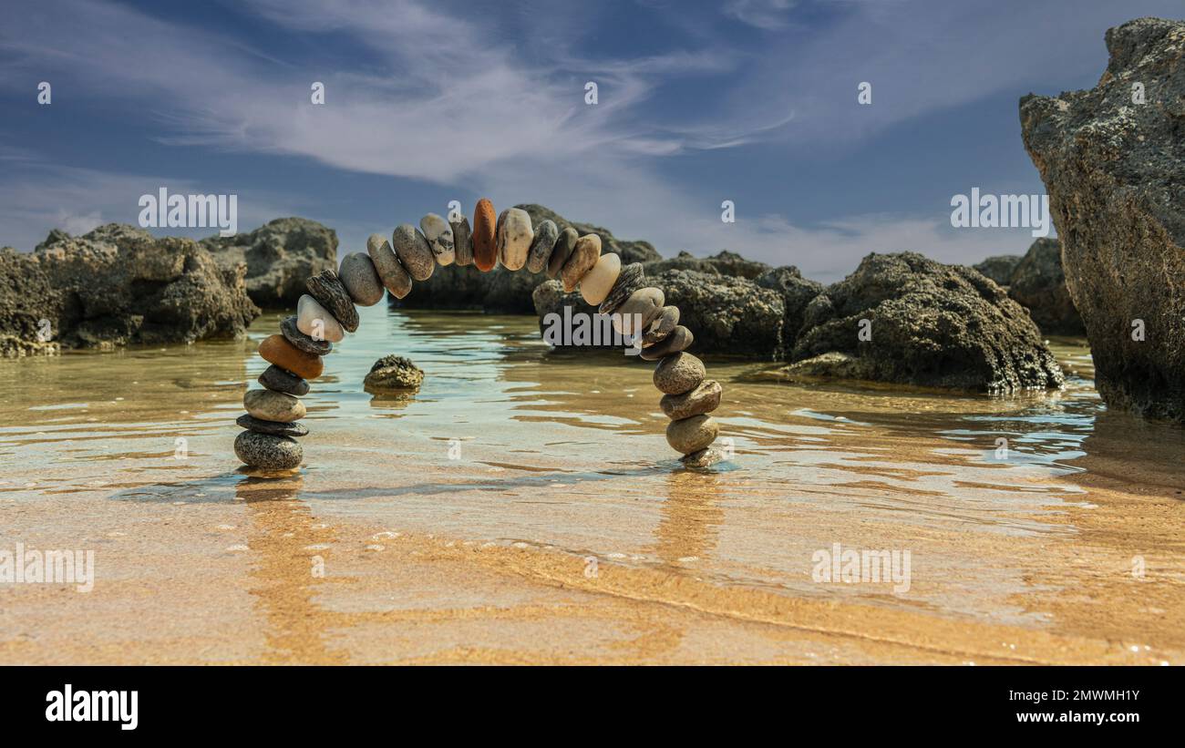 An arch made of small stones(Rock stacking) at the famous Balos beach ...