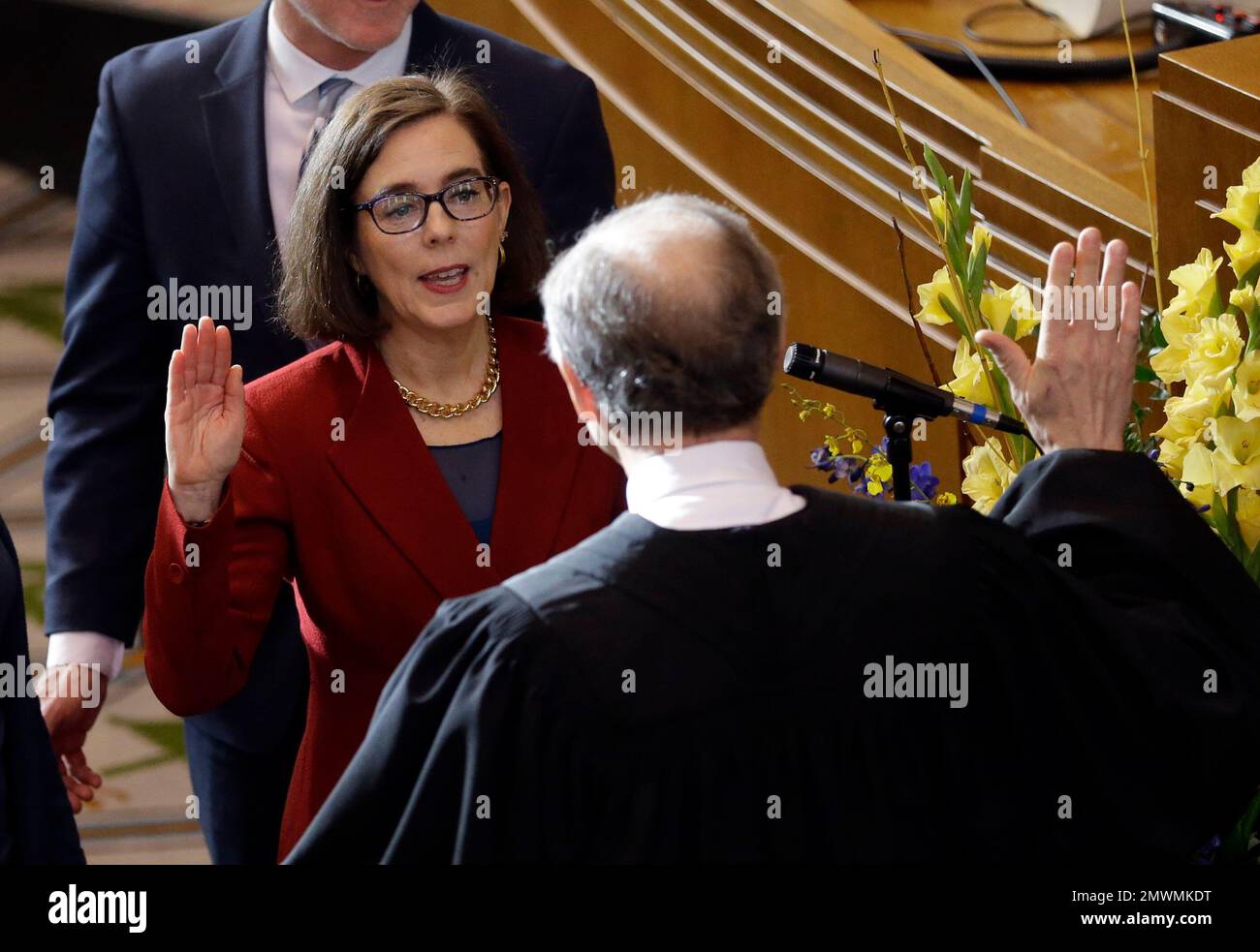 Oregon Gov. Kate Brown, left, is sworn in by Oregon Chief Justice ...
