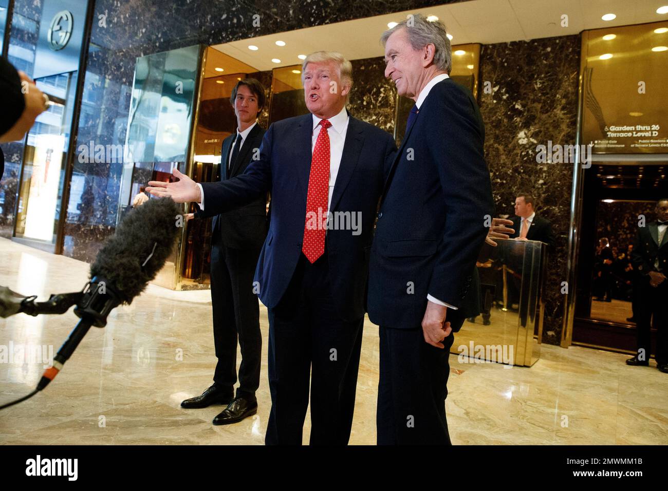President-elect Donald Trump stands with French businessman Bernard ...