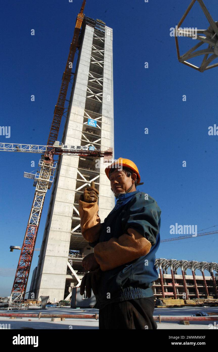 A worker stands at the Grand Mosque of Algiers under construction in ...