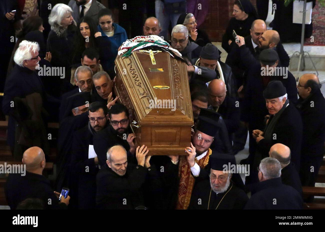 Lebanese clergymen carry the coffin of Monsignor Hilarion Capucci, a ...