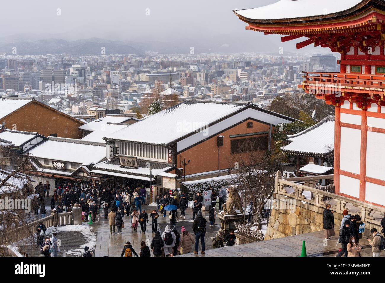 Japanese traditional buildings at Kiyomizu-zaka slope with snow in ...