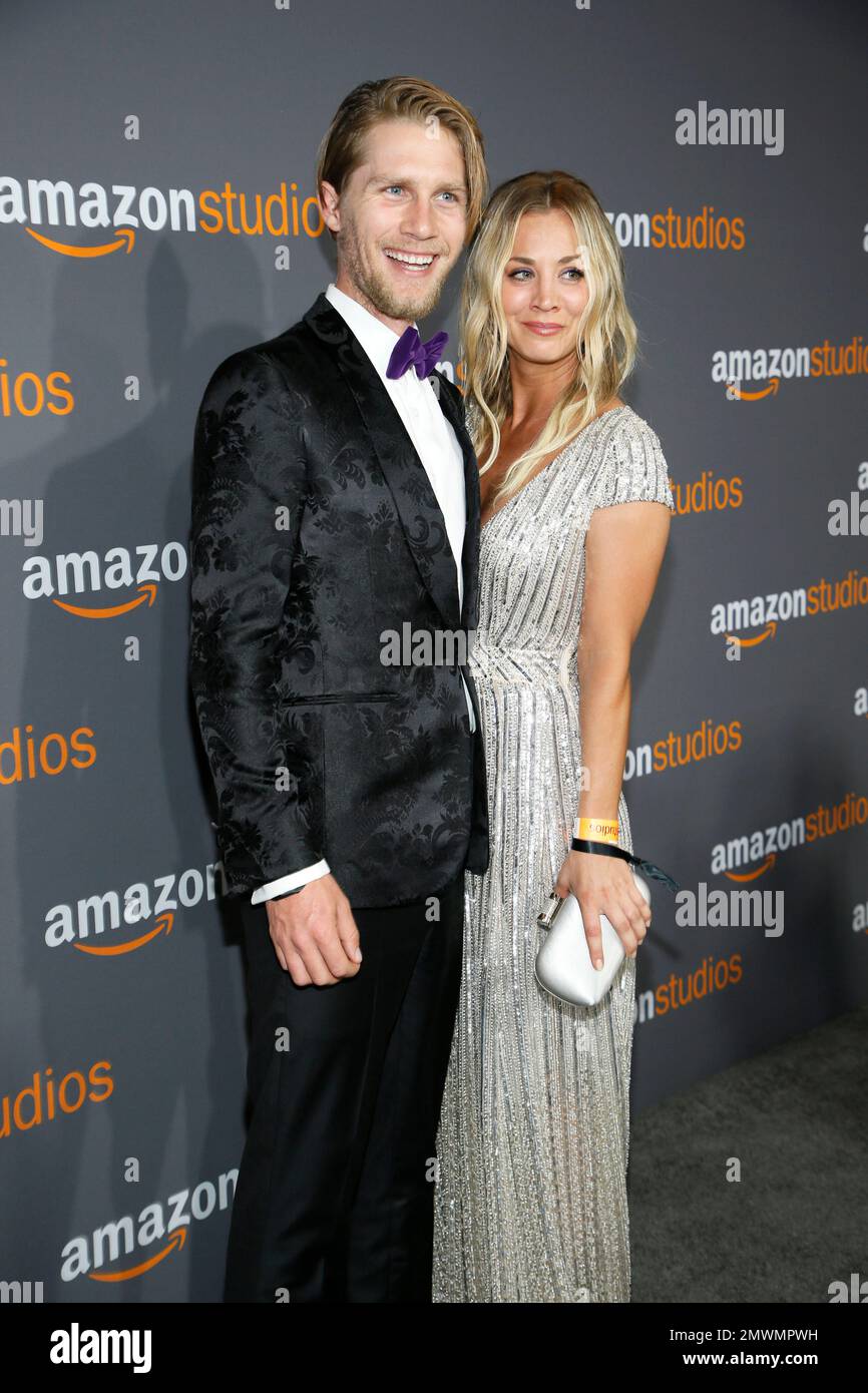 Karl Cook, left, and Kaley Cuoco arrive at the Amazon Studios Golden ...