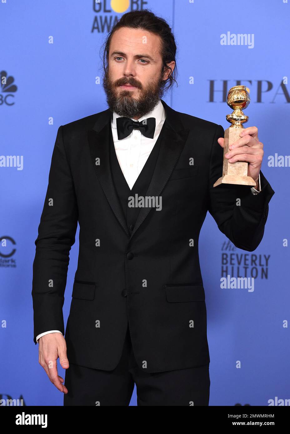 Casey Affleck poses in the press room with the award for best ...