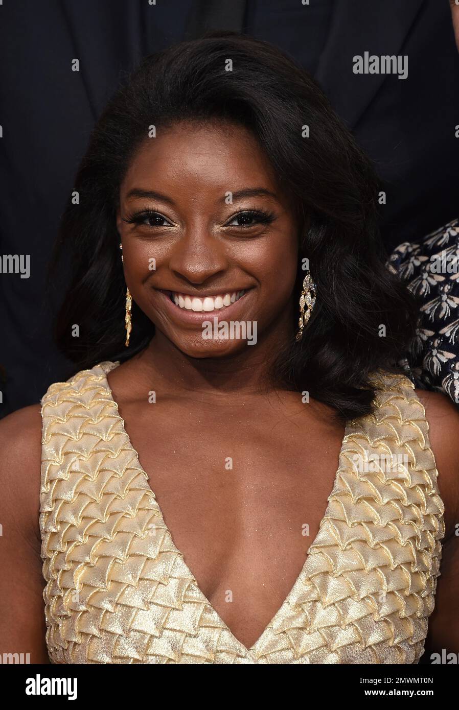 Simone Biles arrives at the 74th annual Golden Globe Awards at the ...
