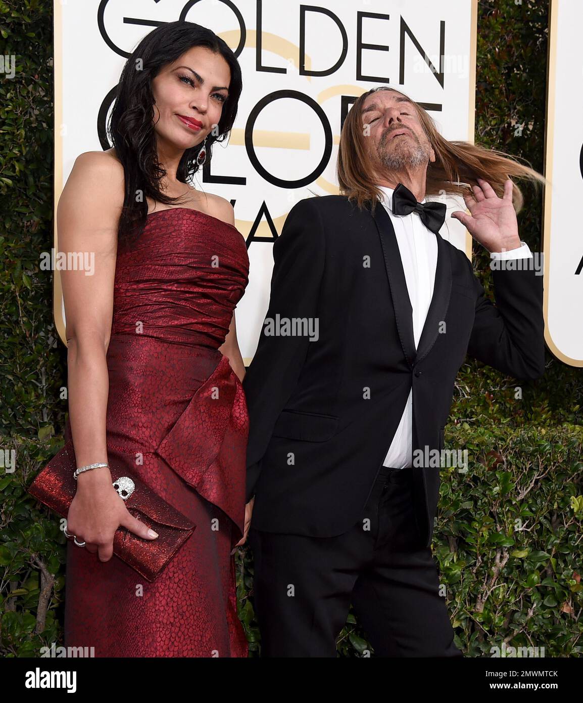 Nina Alu, left, and Iggy Pop arrive at the 74th annual Golden Globe ...