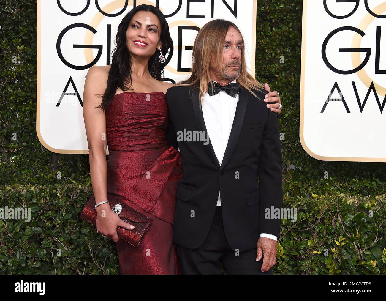 Nina Alu, left, and Iggy Pop arrive at the 74th annual Golden Globe ...