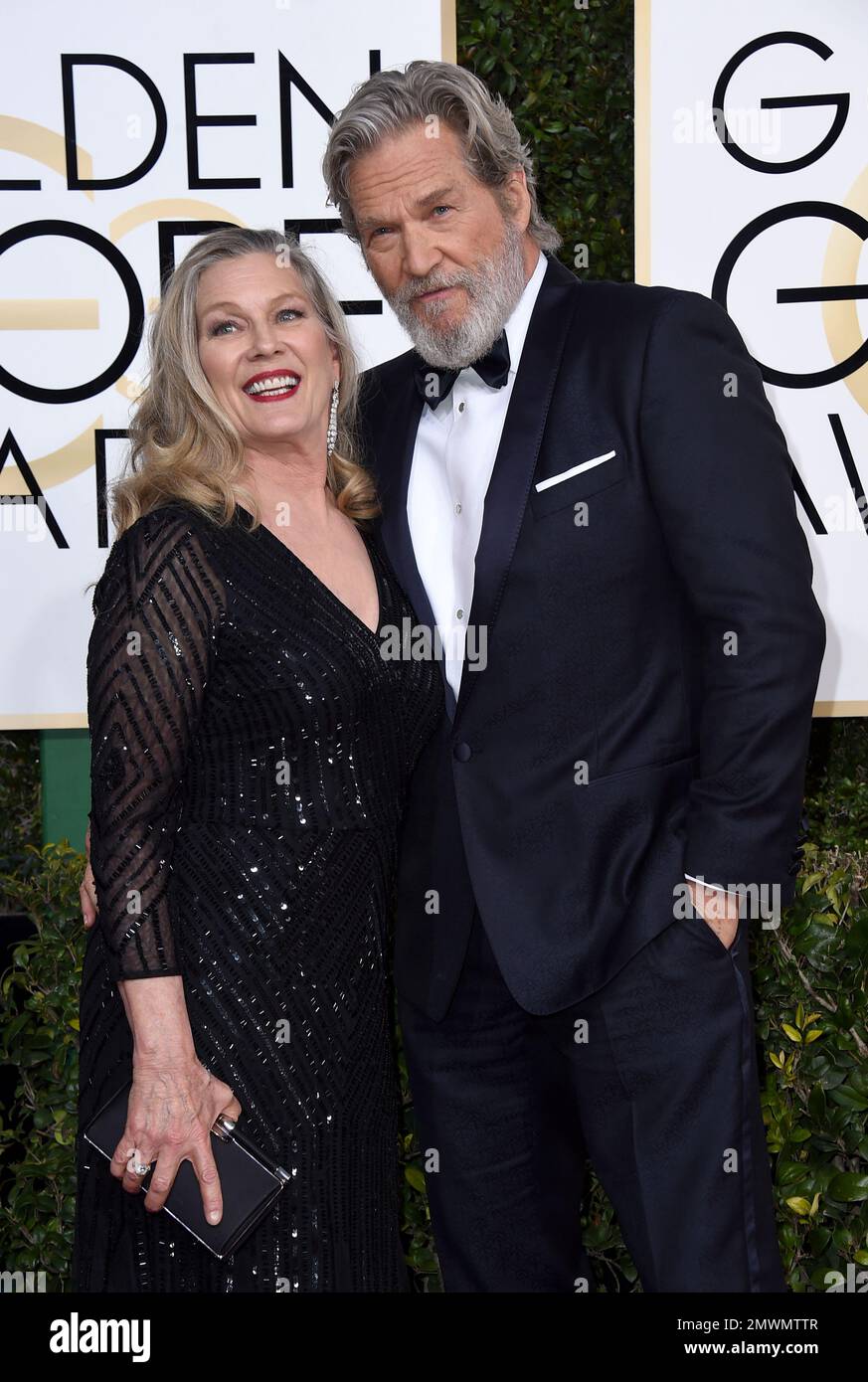 Susan Geston, left, and Jeff Bridges arrive at the 74th annual Golden ...