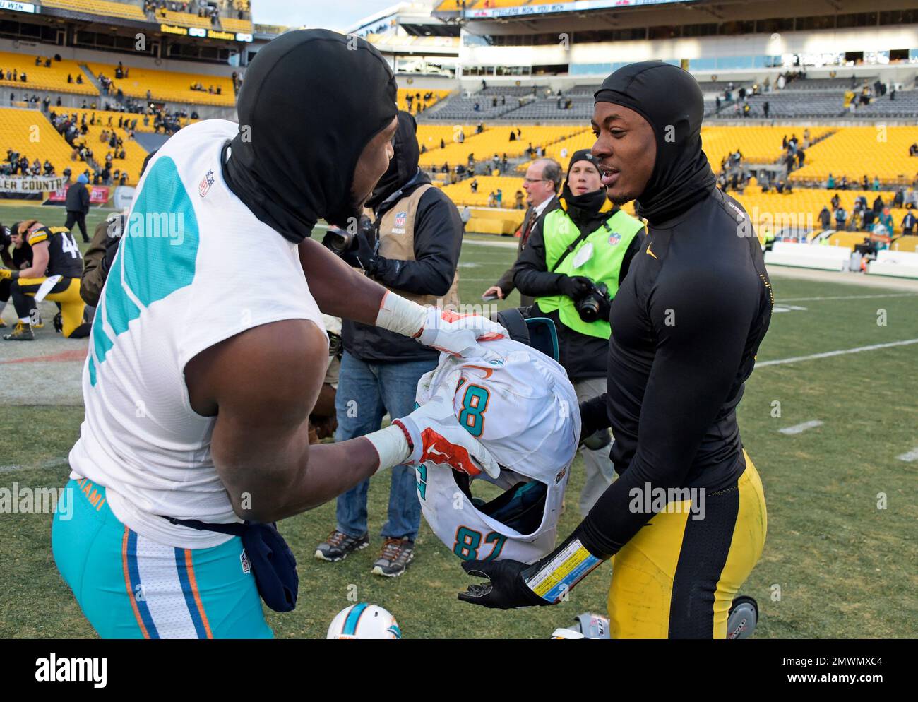Pittsburgh Steelers cornerback Artie Burns, right, and Miami Dolphins ...