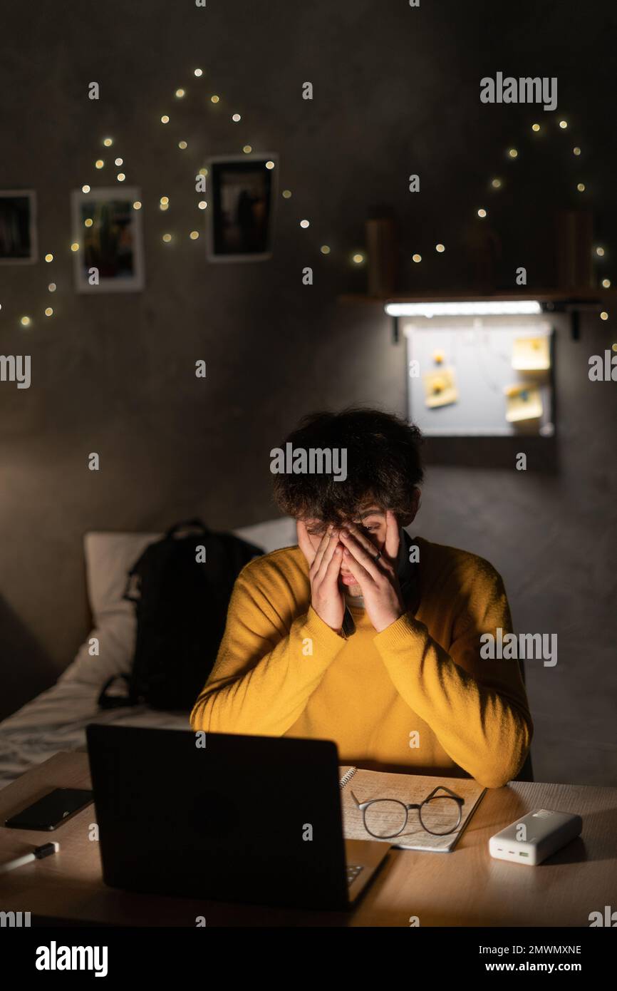 Exhausted male student feeling bad losing concentration unable to learn ...