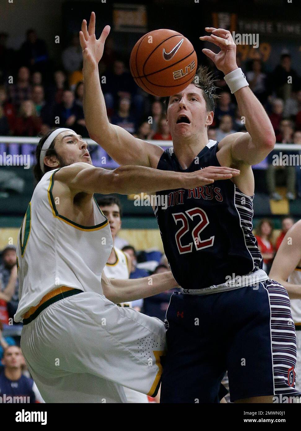Saint Mary's forward Dane Pineau (22) reaches for the ball next to San ...
