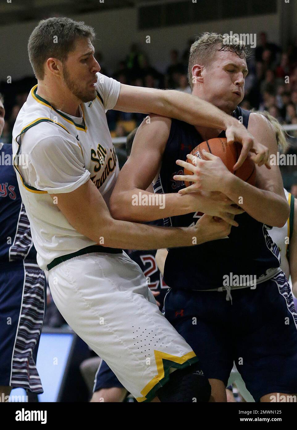 St. Mary's center Jock Landale, right, grabs a rebound next to San ...