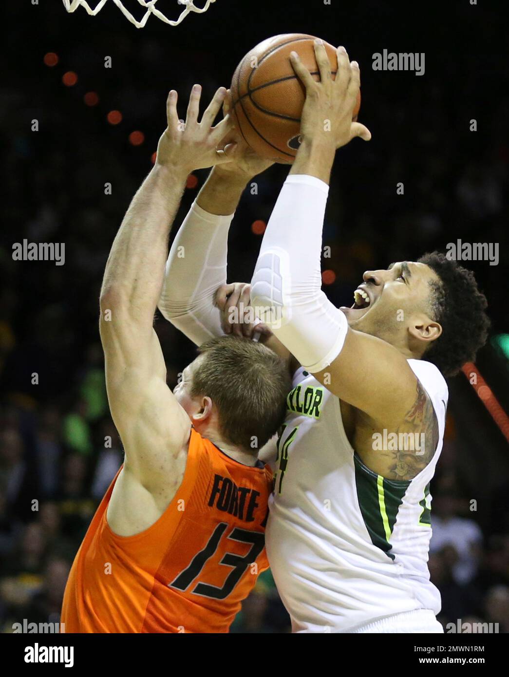 Baylor guard Ishmail Wainright, right, battles Oklahoma State guard ...