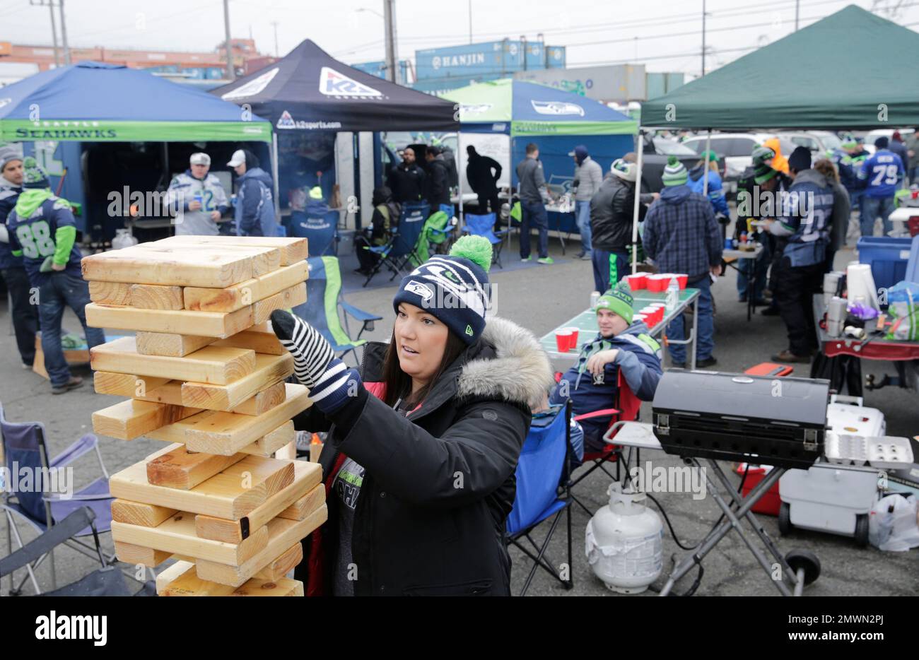 Seattle Seahawks fans play a wooden block stacking game as they ...