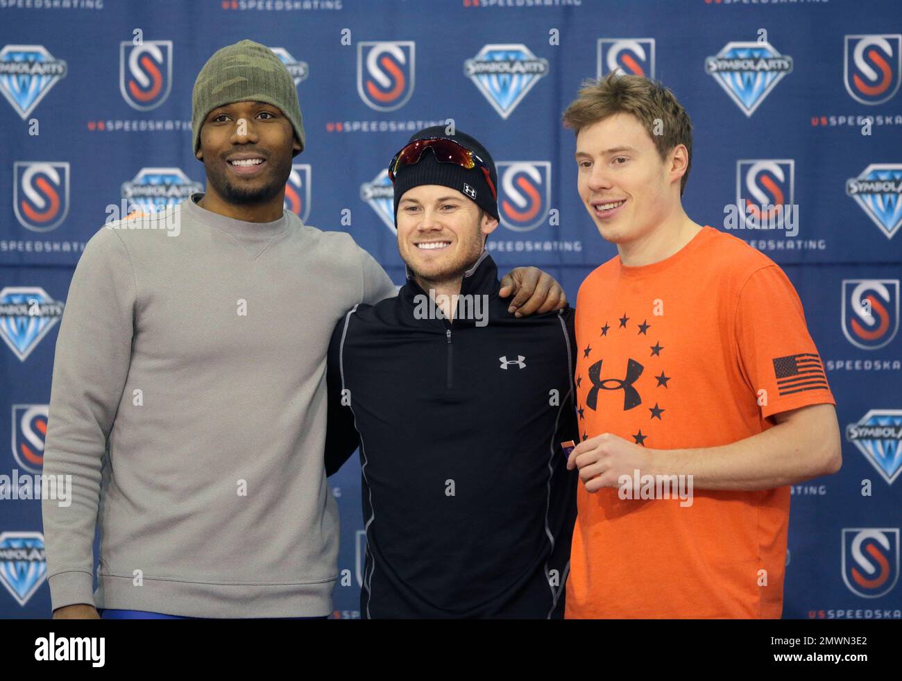 First-place finisher Joey Mantia, center, second-place finisher Shani ...