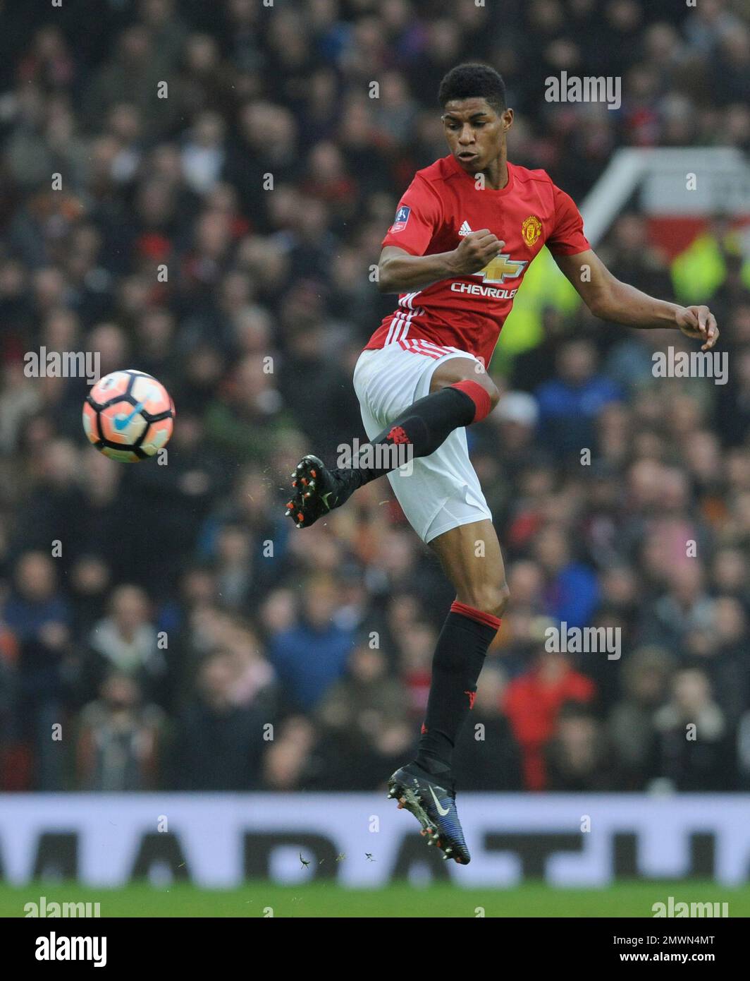 Manchester United's Marcus Rashford jumps to control the ball during ...