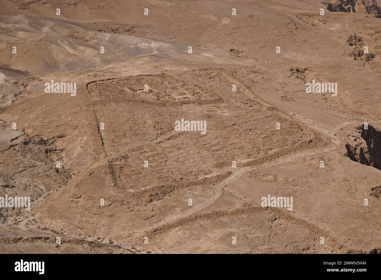 An aerial view of Masada with ancient fortress and rocky mountains in ...