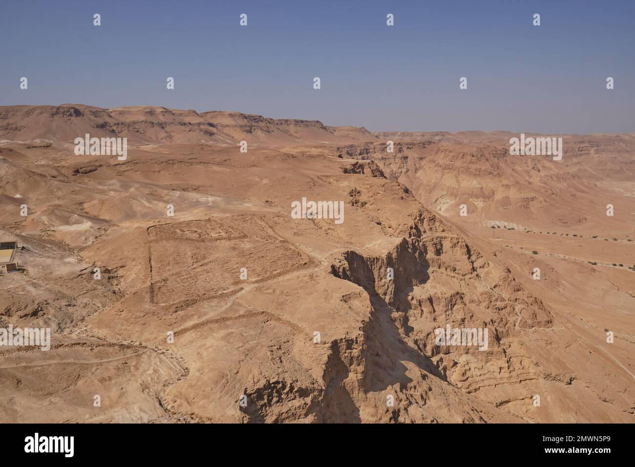 An aerial view of Masada with ancient fortress and rocky mountains in ...