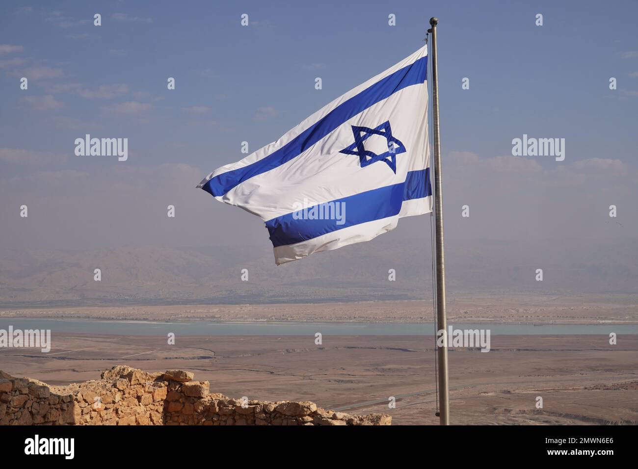 The Israeli flag flying on Masada fortress in Israel with Judean Desert ...