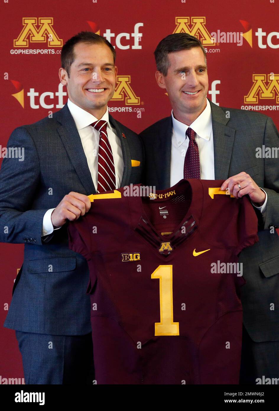 University of Minnesota athletic director Mark Coyle, right, introduces ...