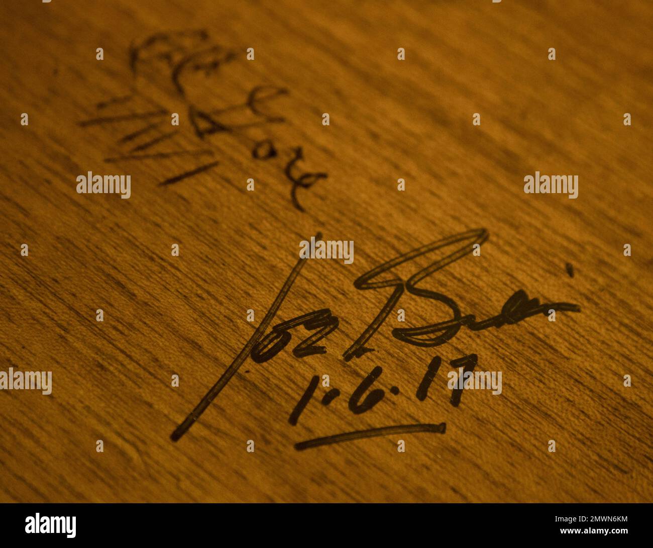The drawer of the vice president's desk is shown with the signature of ...