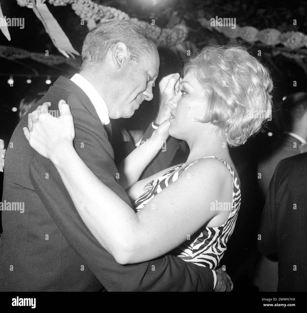 Screen star Kim Novak dances with movie director Richard Quine during a ...