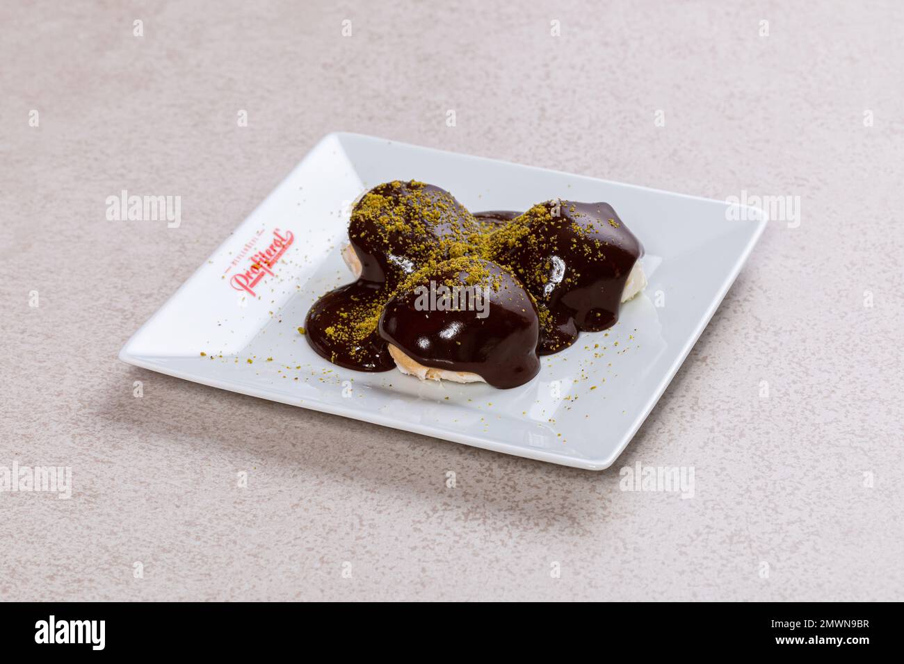 Turkish sweets on white background, beylerbeyi profiteroles Stock Photo ...
