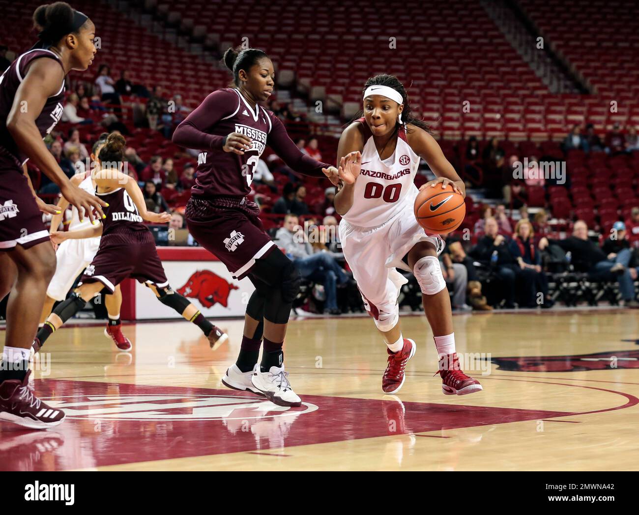 Arkansas forward Jessica Jackson (00), right, drives by Mississippi ...