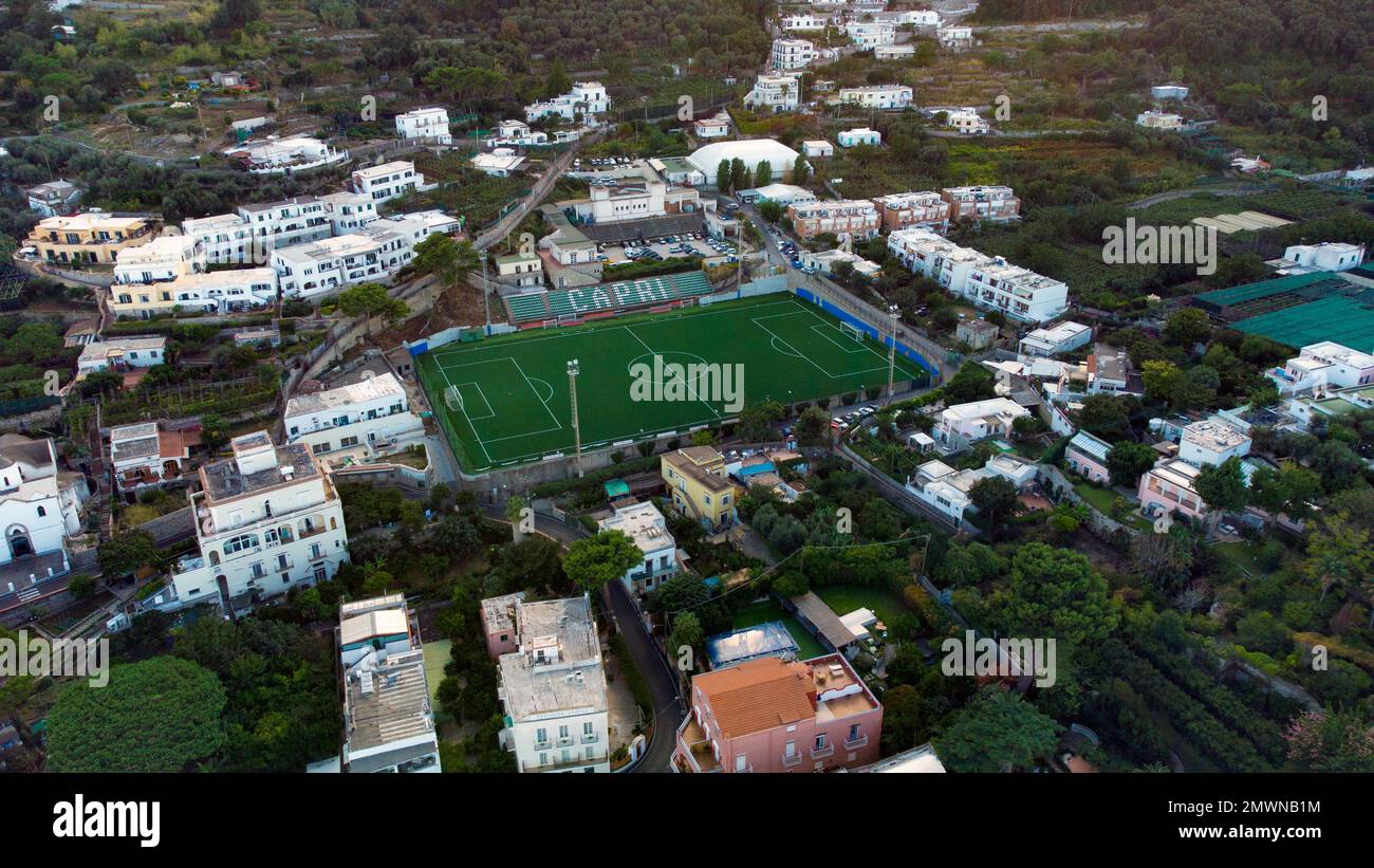 An aerial view of a football field surrounded with buildings located in ...
