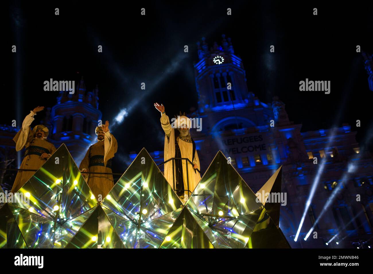 A man dressed as Melchor, right, one of the Three Wise Man waves to the ...