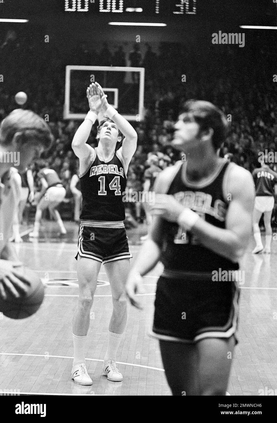 Ole Miss basketball star Johnny Neumann (14) follows his shot as the ...