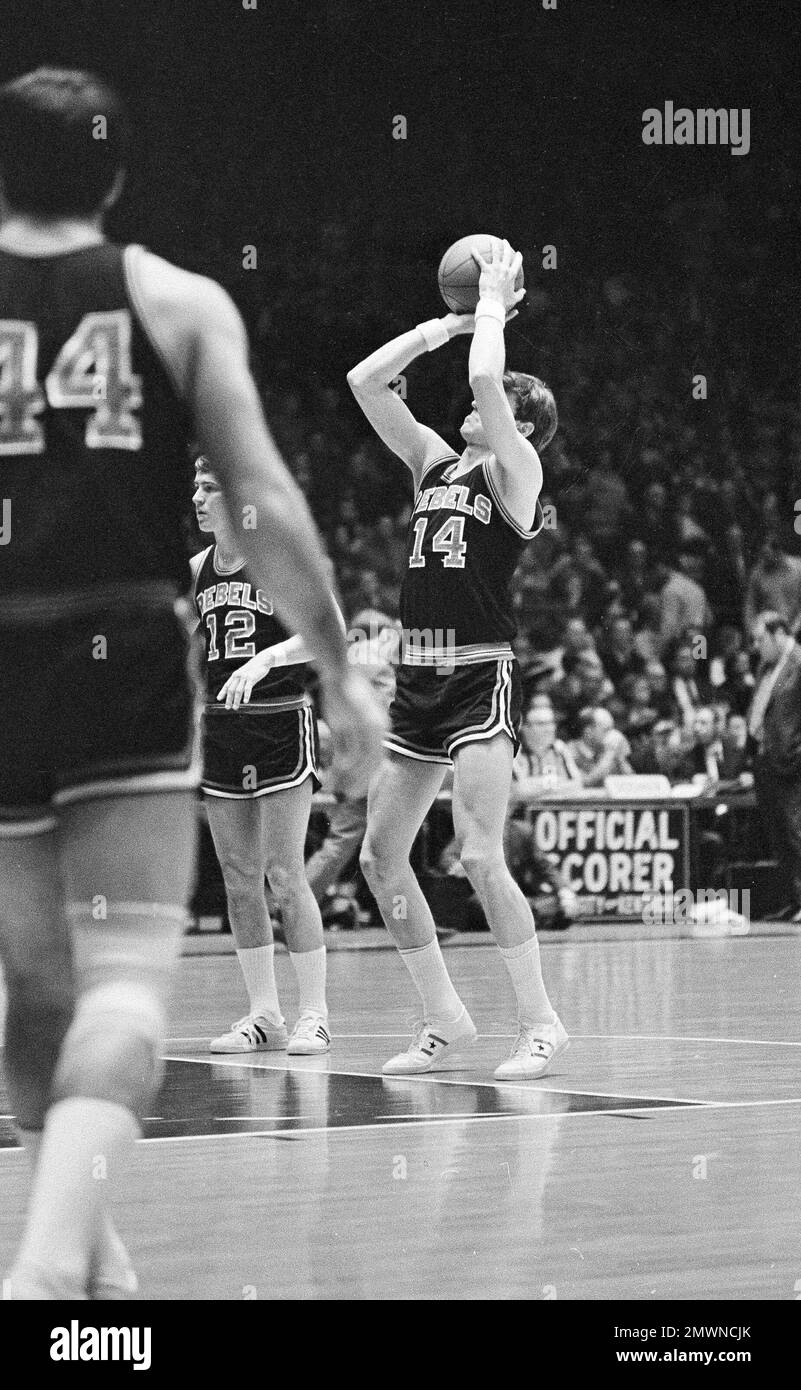Ole Miss basketball star Johnny Neumann (14) practices his foul shots ...