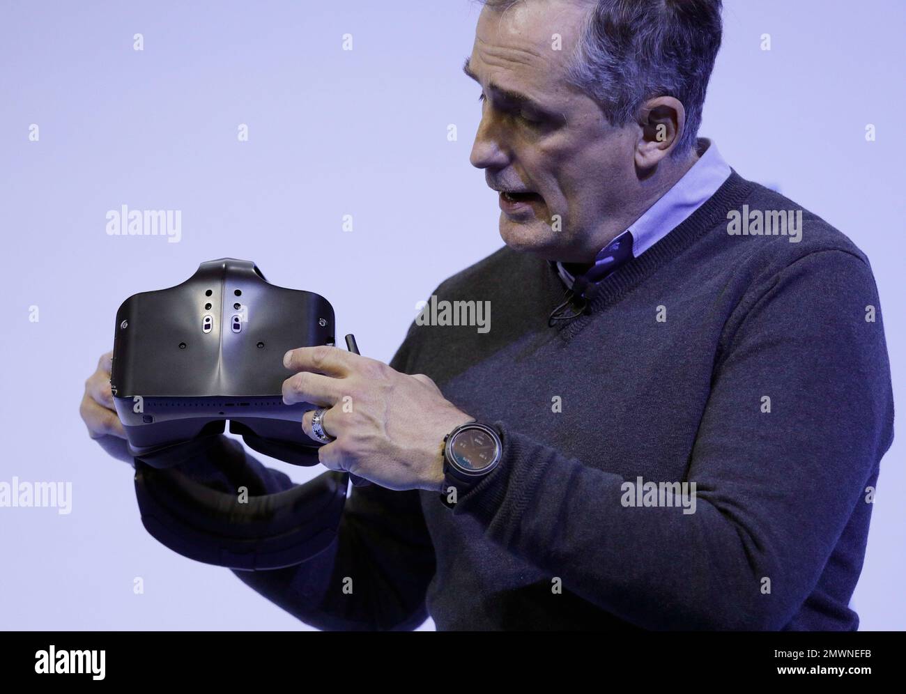 Intel CEO Brian Krzanich holds a Project Alloy all-in-one merged ...