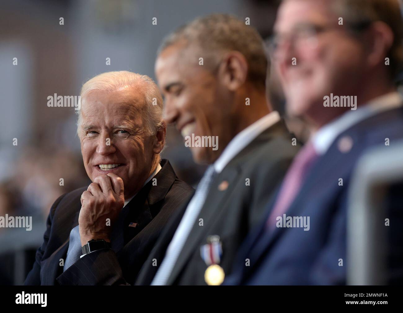 Vice President Joe Biden, left, watches President Barack Obama, center ...