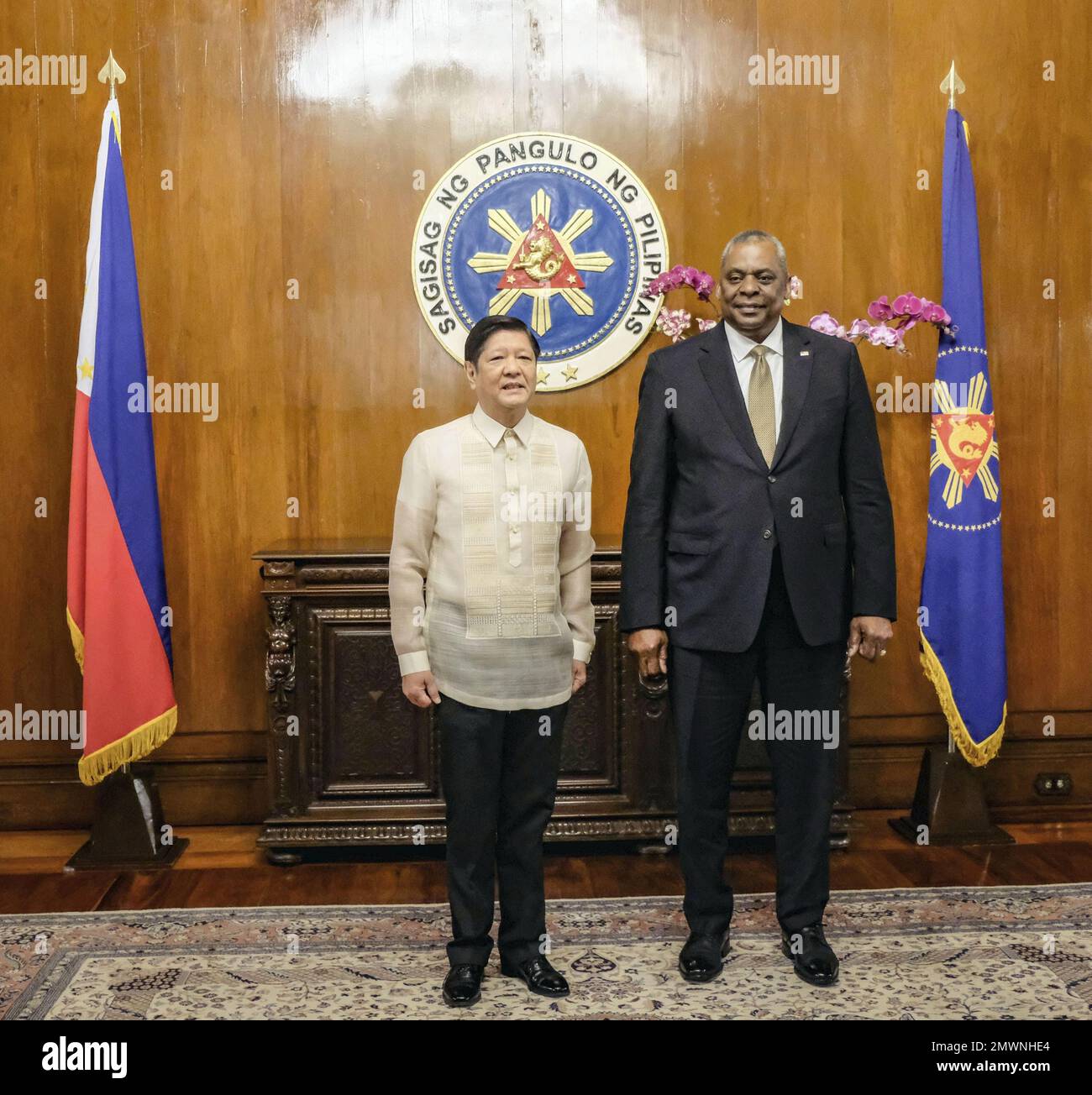 U.S. Defense Secretary Lloyd Austin (R) poses for a photo with ...