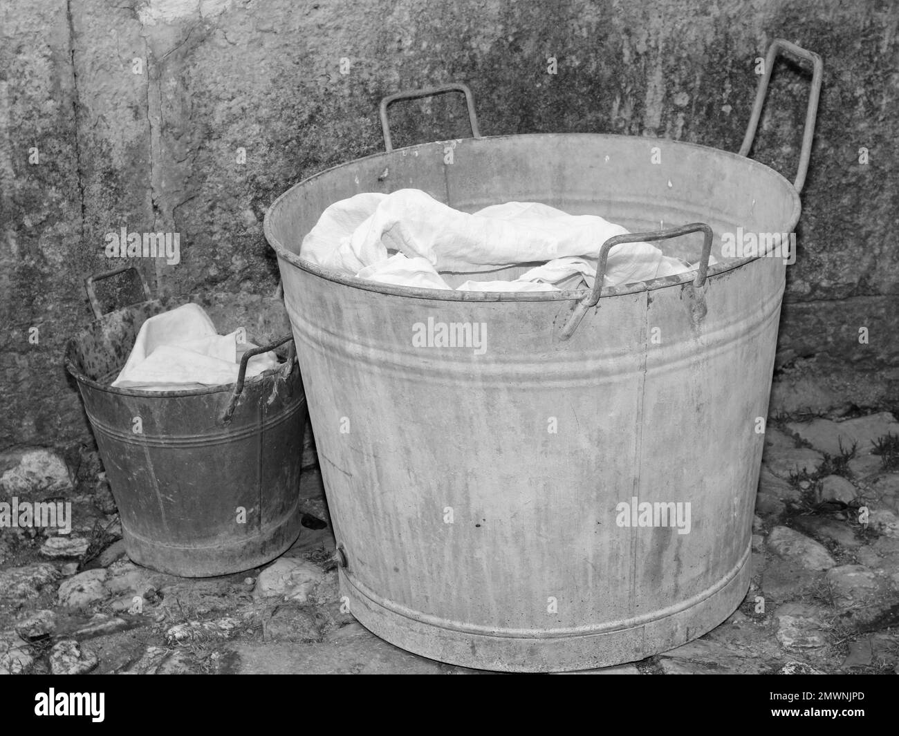 ancient metal tub for doing the laundry of the poor peasant ...