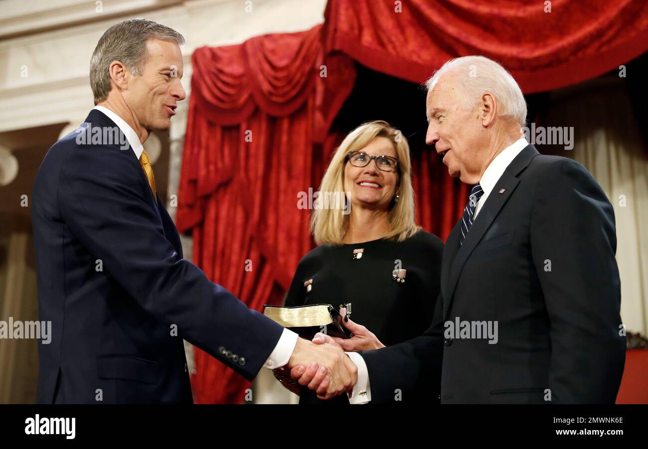 Vice President Joe Biden, right, shakes hands with Sen. John Thune, R-S ...