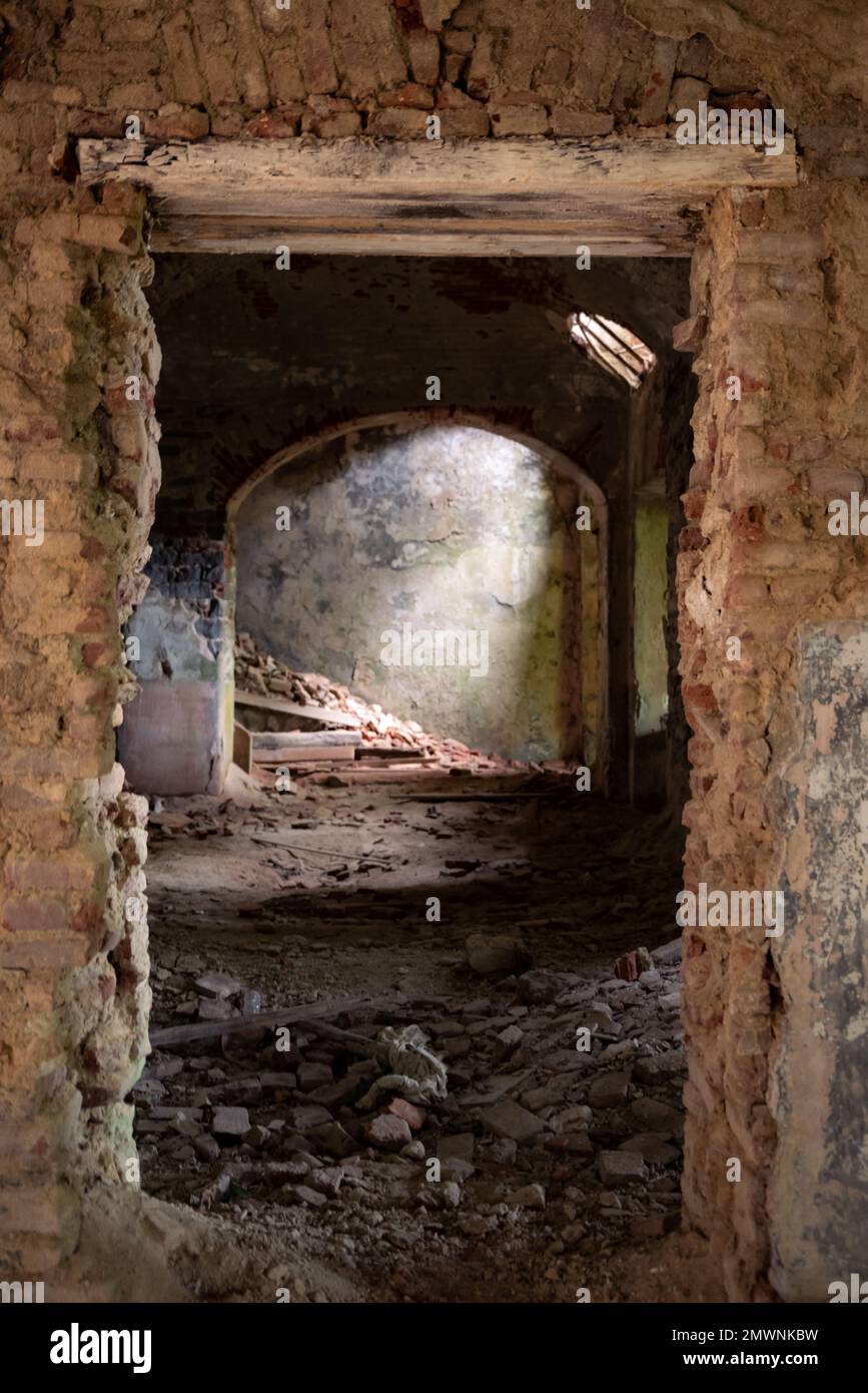 An abandoned place with natural light seeping through the window in the ...