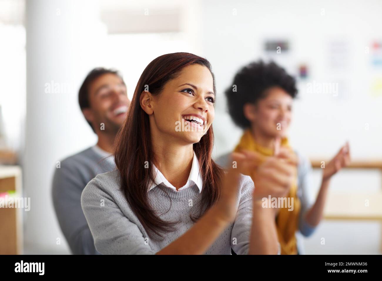 Her admiration is undeniable. A beautiful young woman sitting and ...