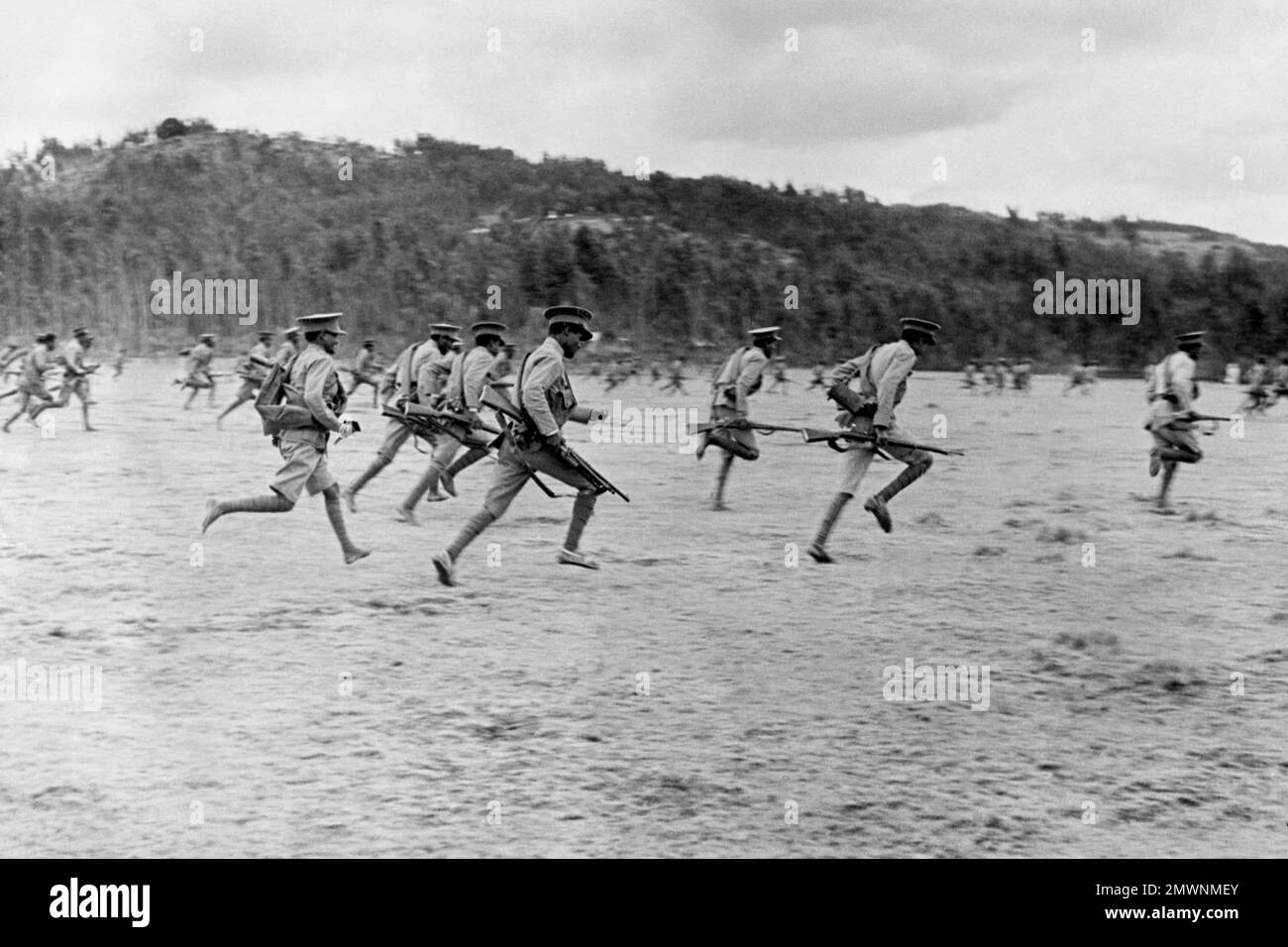 Abyssinian troops practising an attack over open ground during training ...