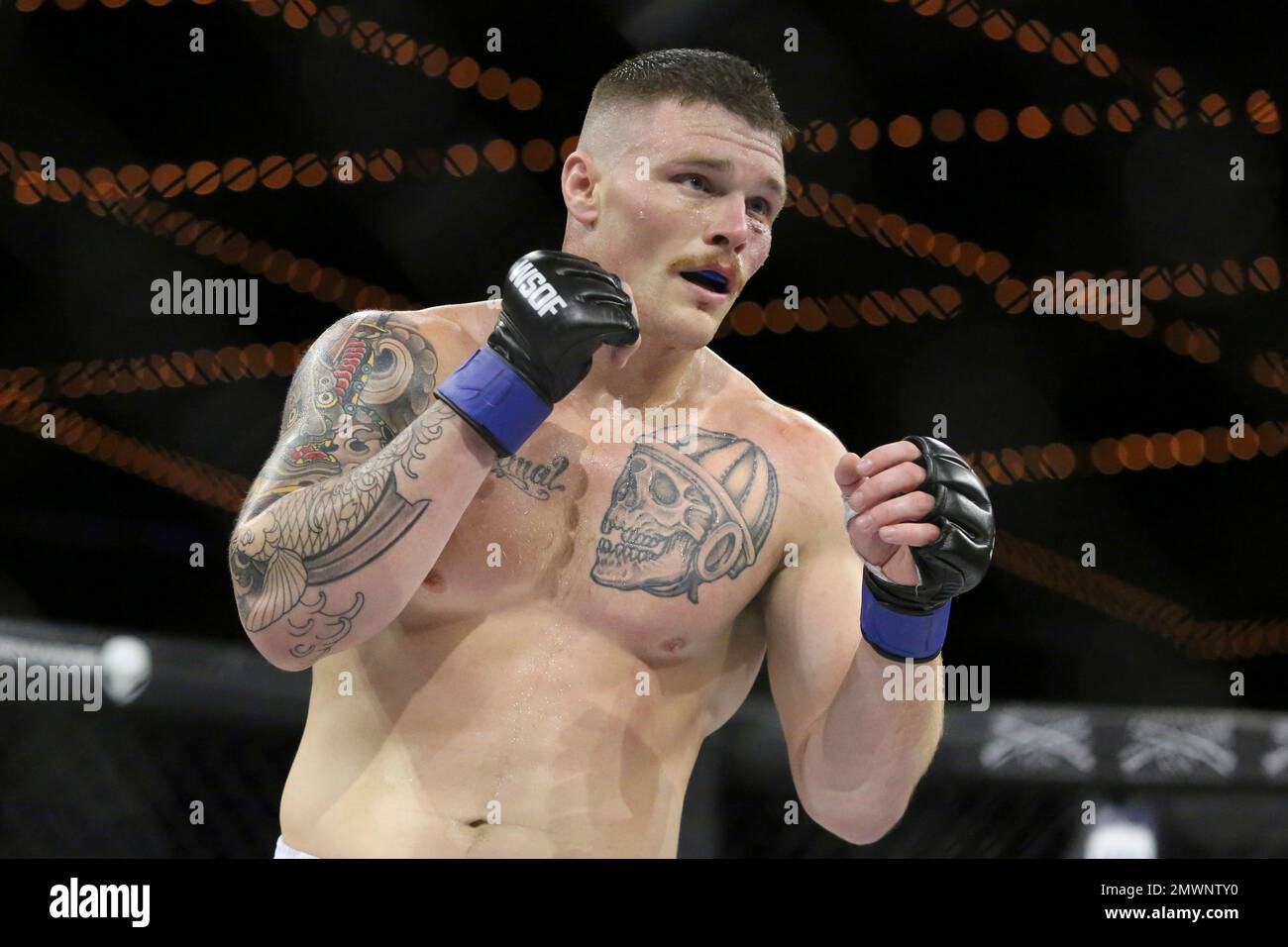 Jake Heun in action against Smealinho Rama during their light ...