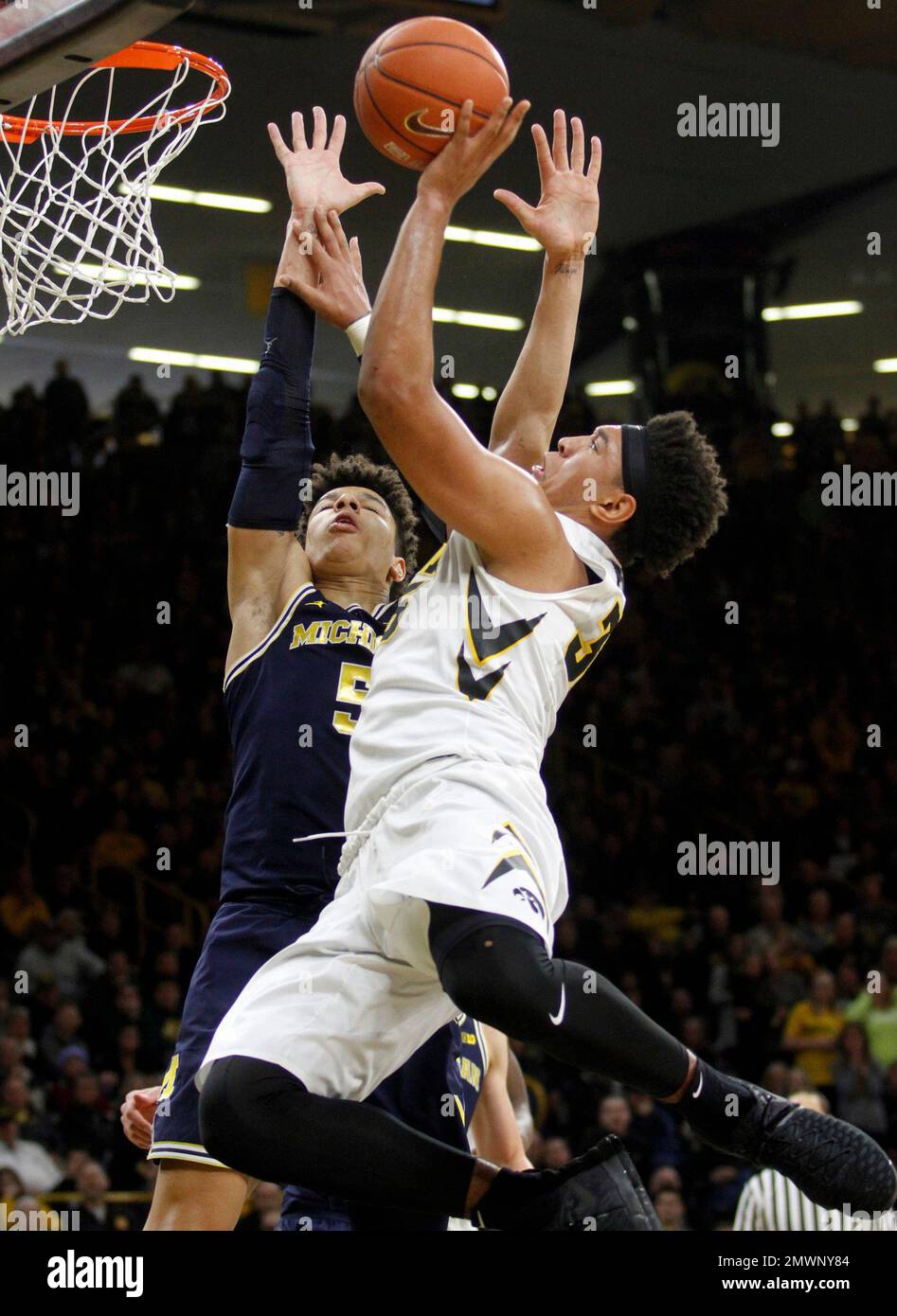 Iowa's Cordell Pemsl (35) goes to the basket against Michigan's D.J ...